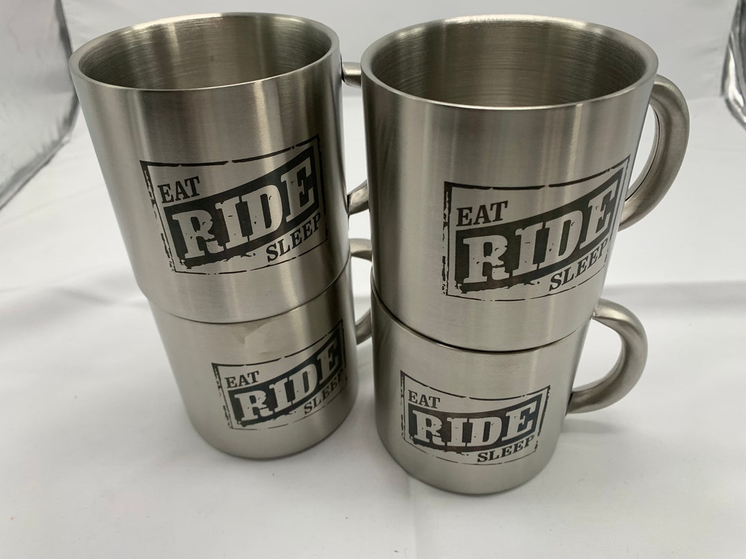 A Set of Four, New in the Box, Stainlesssteel Mugs With “eat RIDE Sleep ...