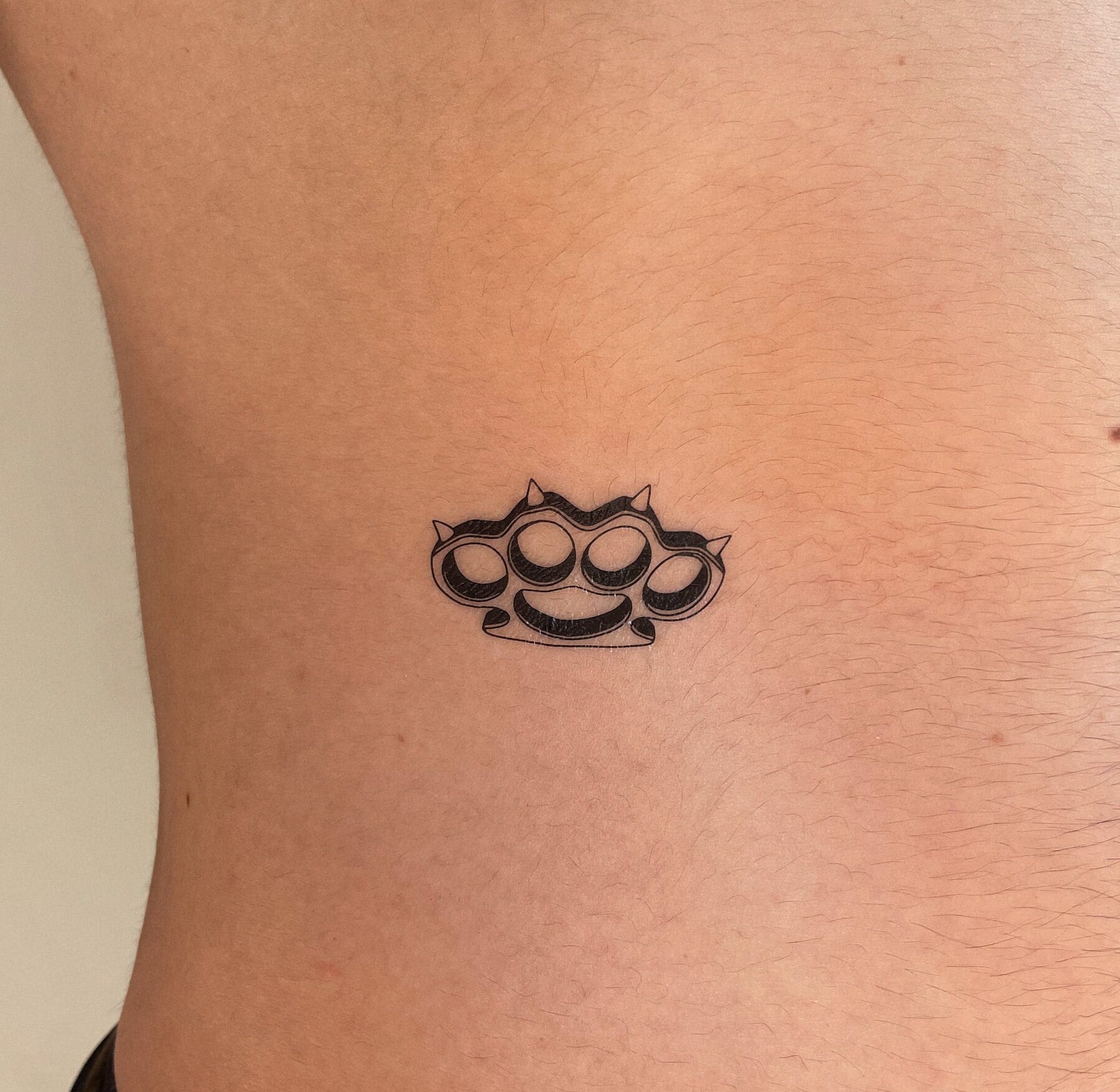 Girly Brass Knuckles Tattoo