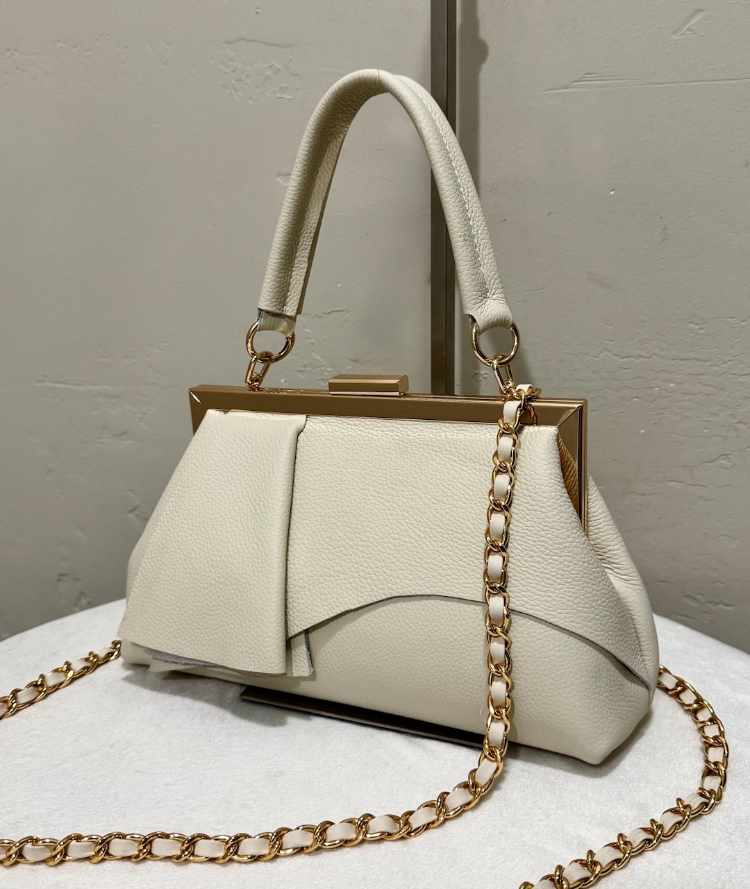 Ivory Pebble Leather With Unique Asymmetrical Ruffles Push Lock Clutch ...