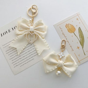 Beautiful Gentle Purple Bow Pearl Keychain Charm Heart-shaped Key Chain ...