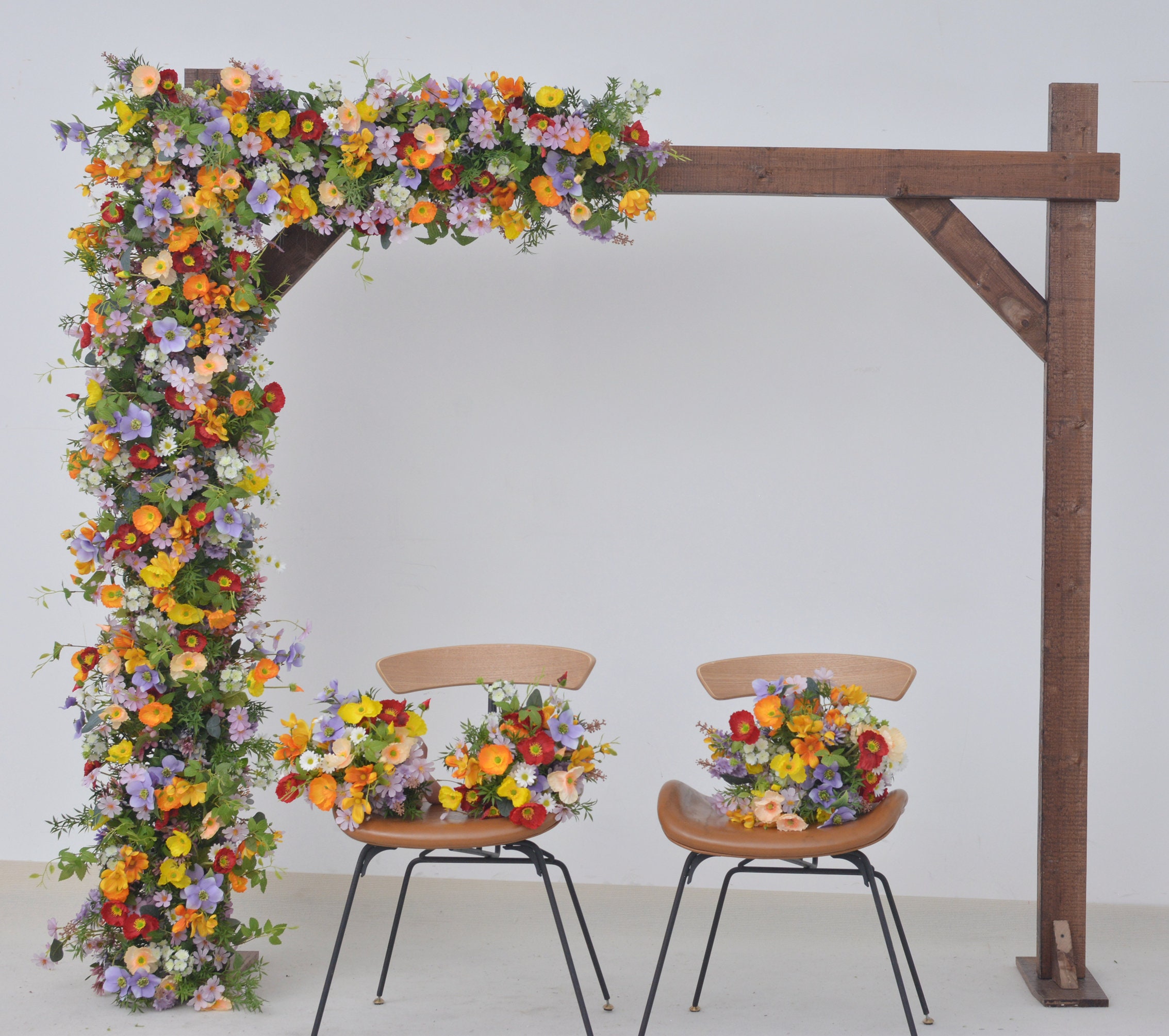 Wildflower Themed Wedding Arch Arrangements in Purple, Orange, Red and ...
