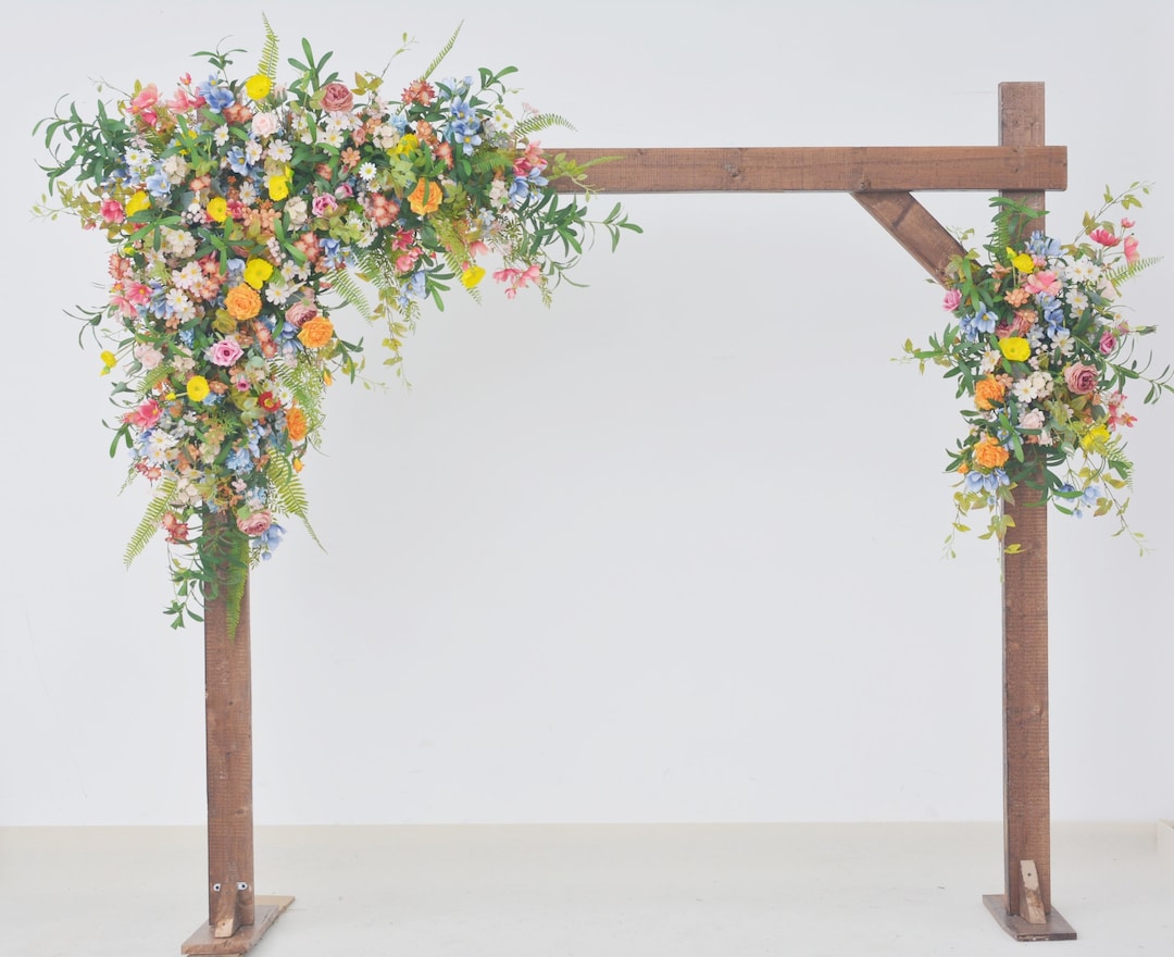 Wildflower Wedding Arbor Arrangements With a Splash of Yellow, Orange ...