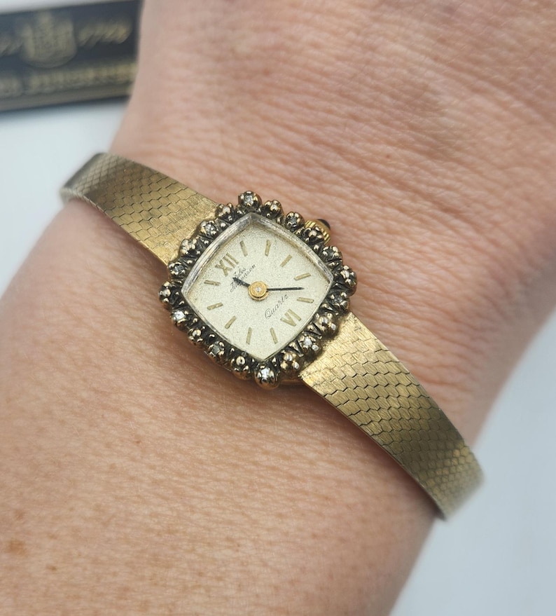 Jules Jurgensen Ladies Gold Toned Diamond Accented Quartz Watch With ...