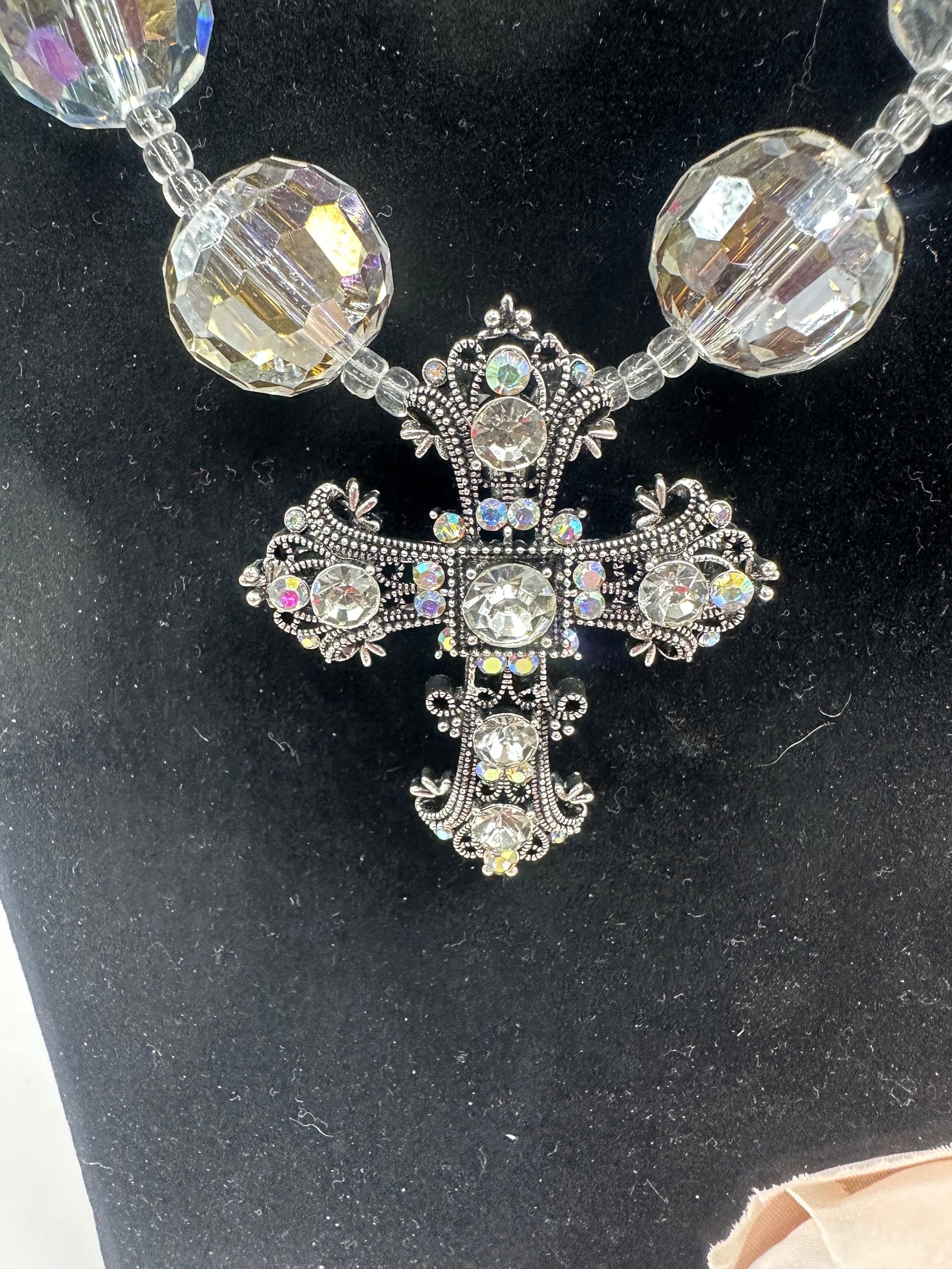 Custom Rhinestone Embellished Cross Pendant Hanging on a Chandelier ...