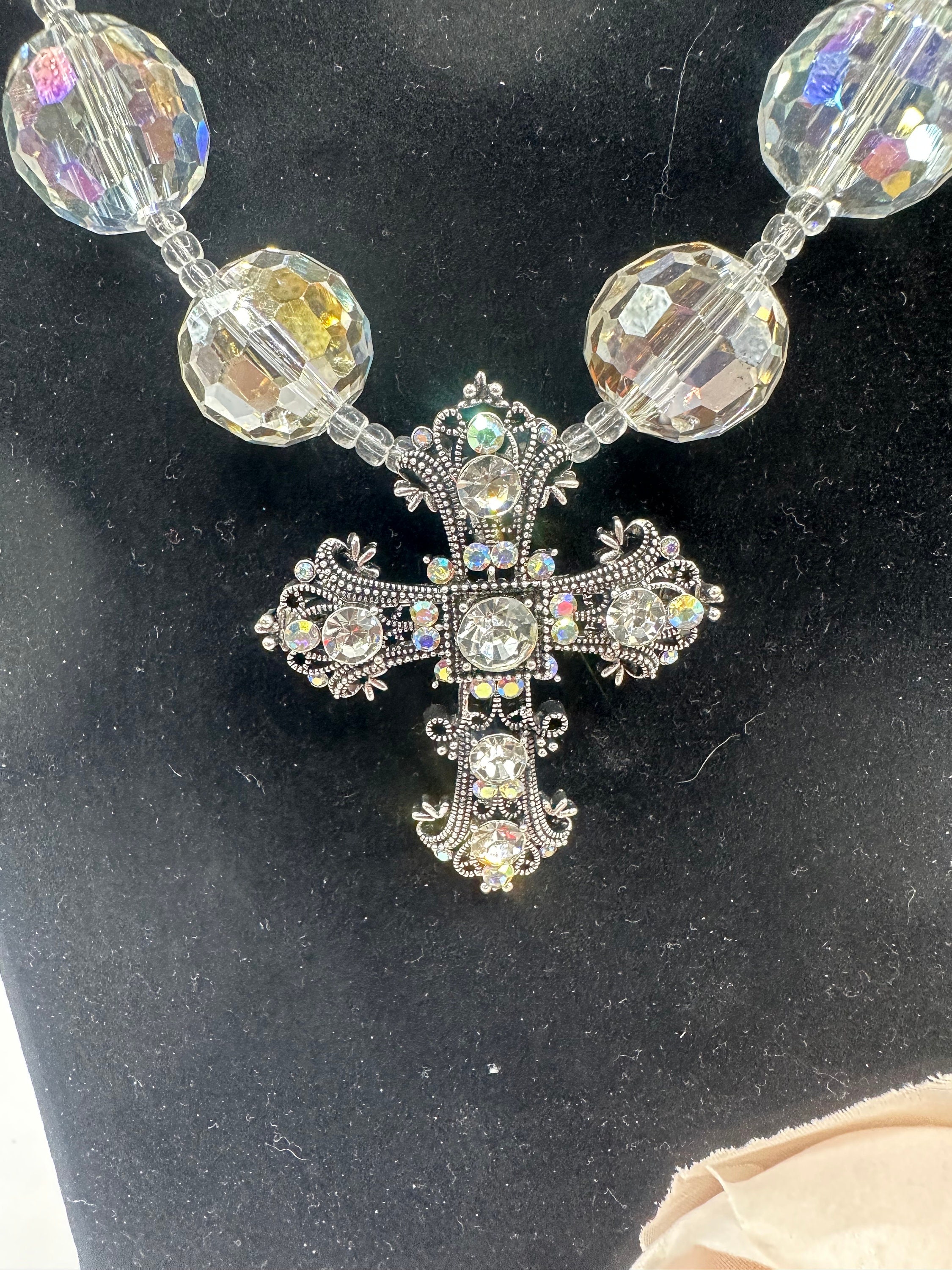 Custom Rhinestone Embellished Cross Pendant Hanging on a Chandelier ...