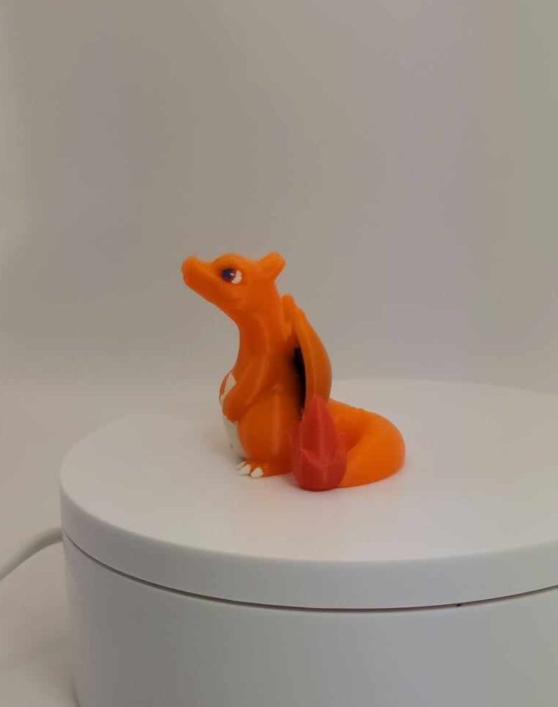 Charming Chibi Charizard: Miniature Figurine Vibrant & Playful Pokémon ...