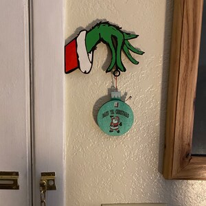 How the Grinch Stole Christmas Grinch’s Hand Holding an Ornament ...