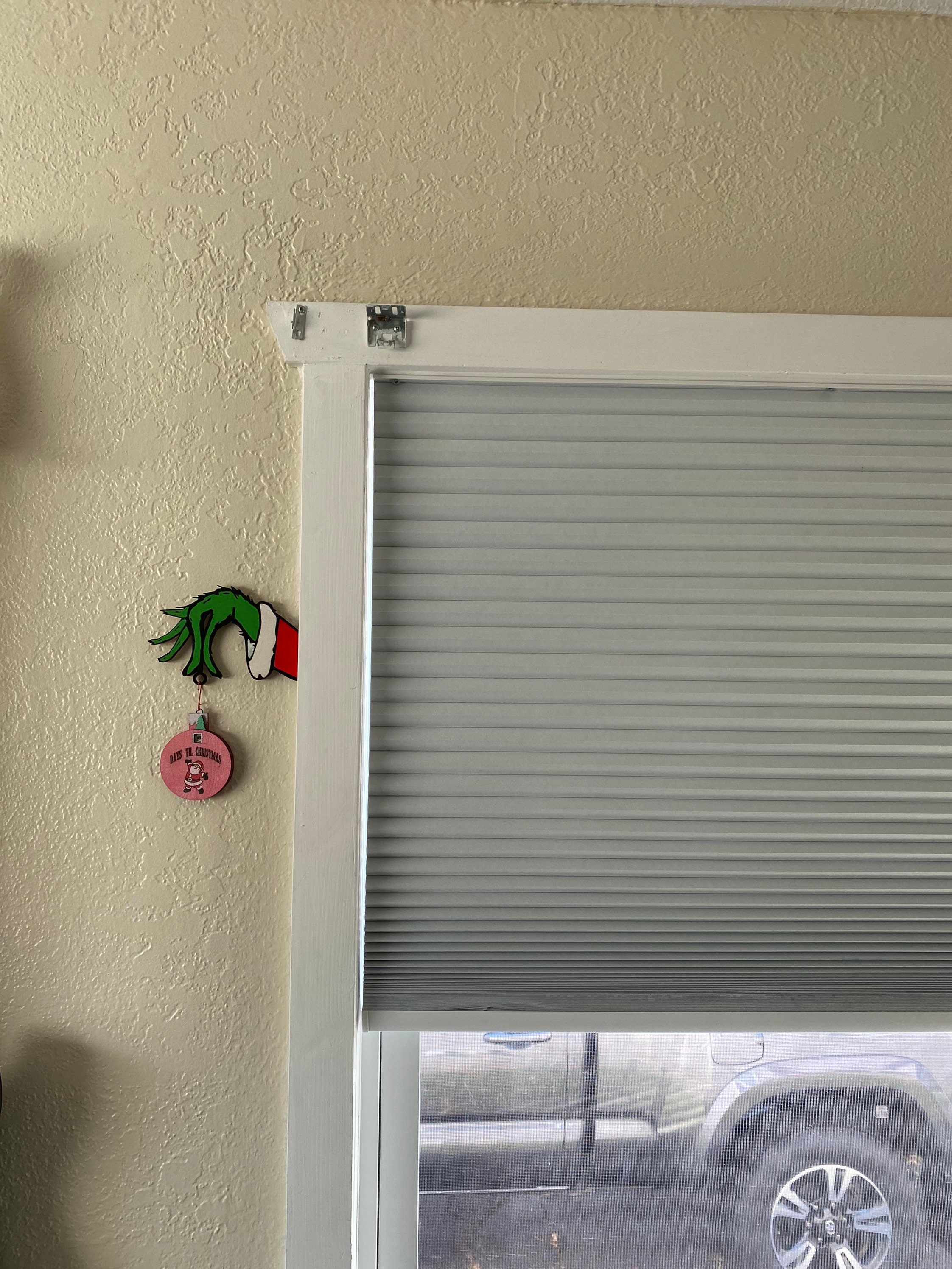 How the Grinch Stole Christmas Grinchs Hand Holding an Ornament Hanging ...