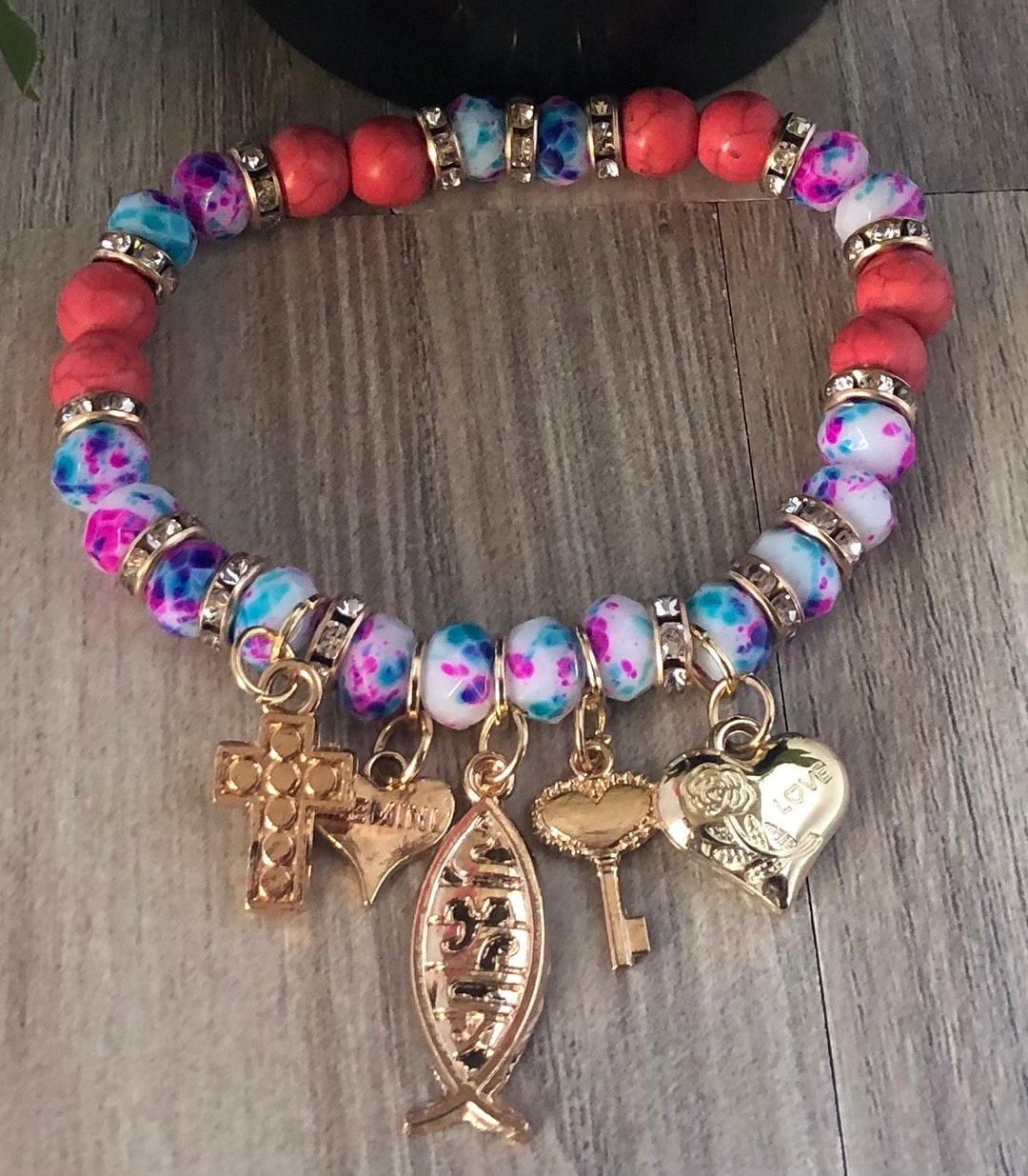 Multi Colored Beaded Stretchable Bracelet With Multiple Charms Jesus ...