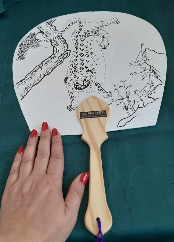 Vintage handheld tiger fan. Cardboard on wood handle … - Gem
