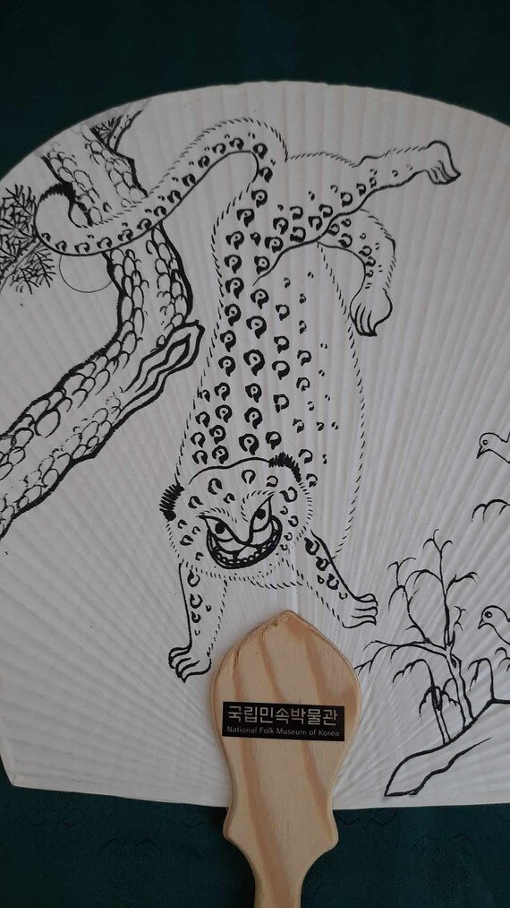 Vintage handheld tiger fan. Cardboard on wood handle … - Gem