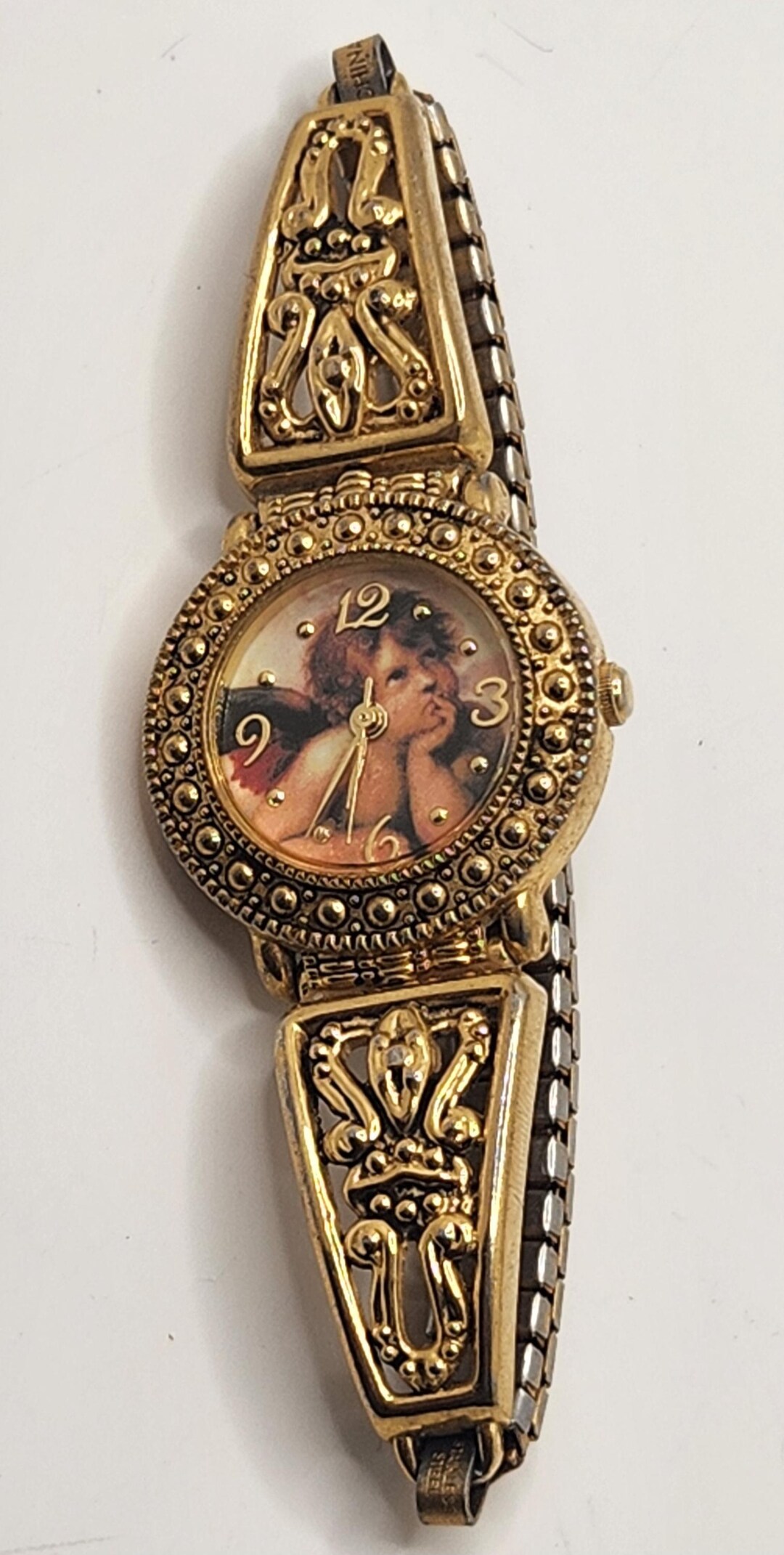 Seiko unmarked Raphael Thinking Cherub Goldtone Stainless Steel Women's ...