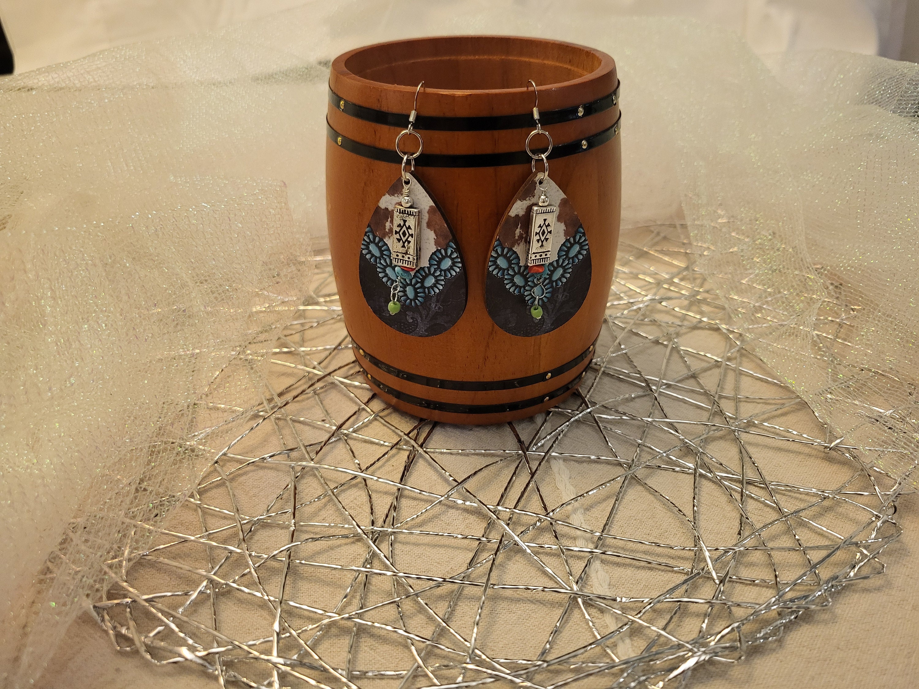 Teardrop Shaped Southwestern Background With Rectangular Metal Charms ...