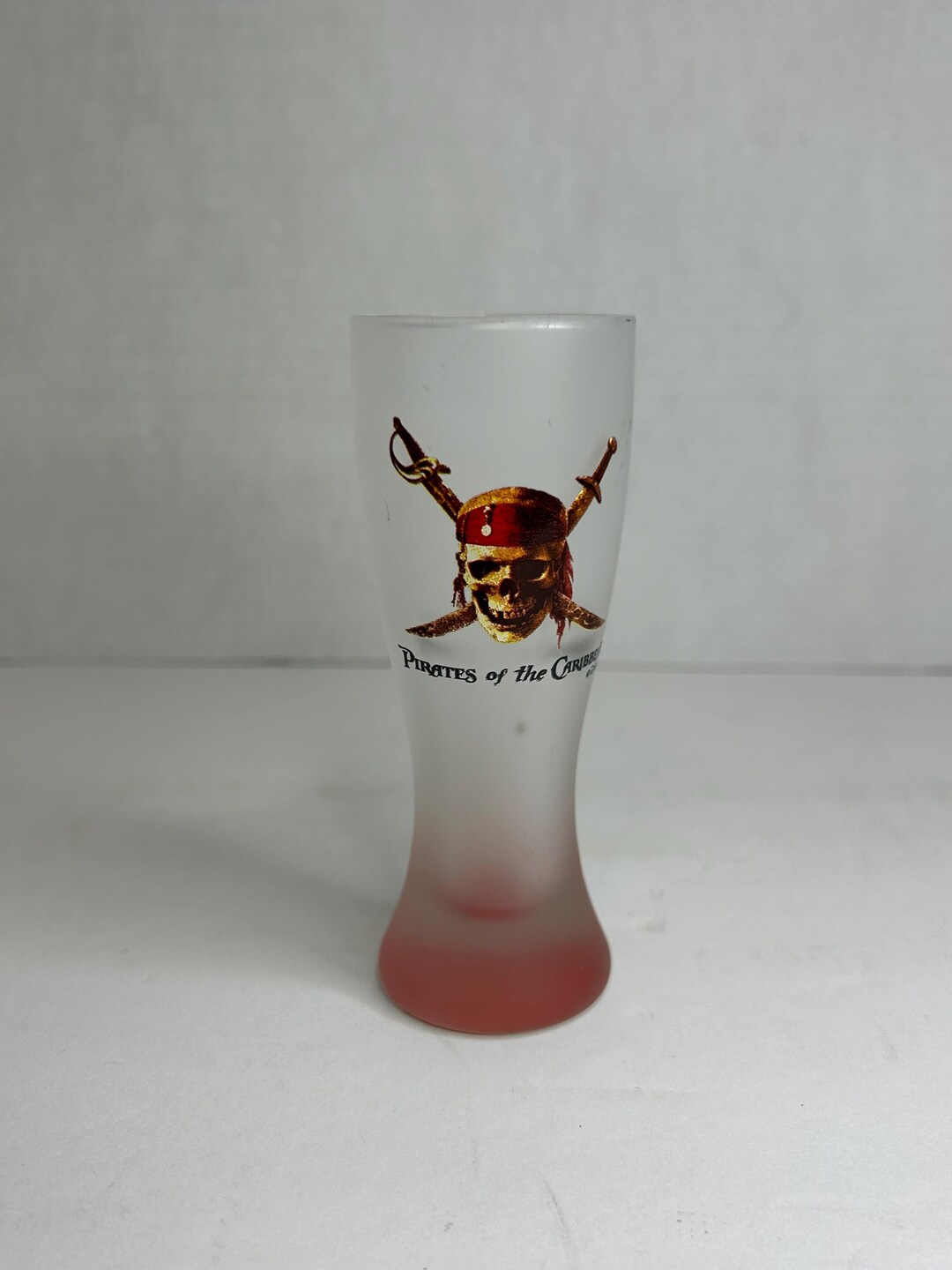 Vintage Pirates of the Caribbean Disney Frosted Red Base Gradient Shot ...