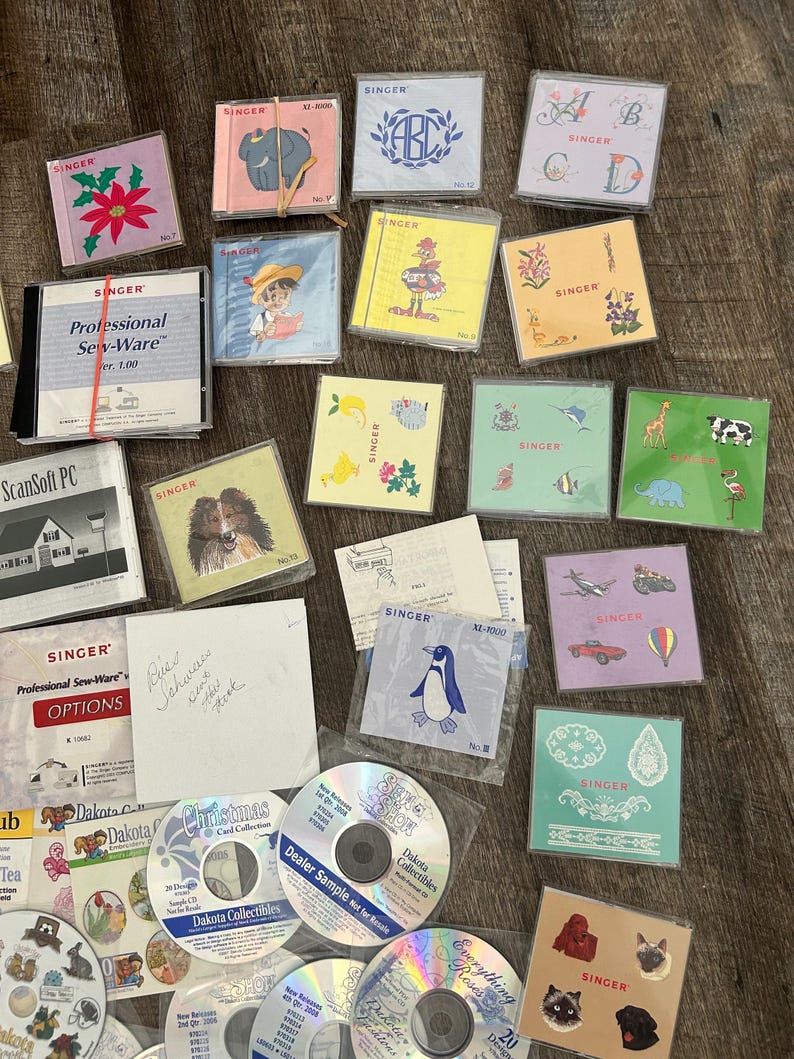 Singer Quantum XL-1000 Sewing Embroidery Machine With Dakota Designs ...