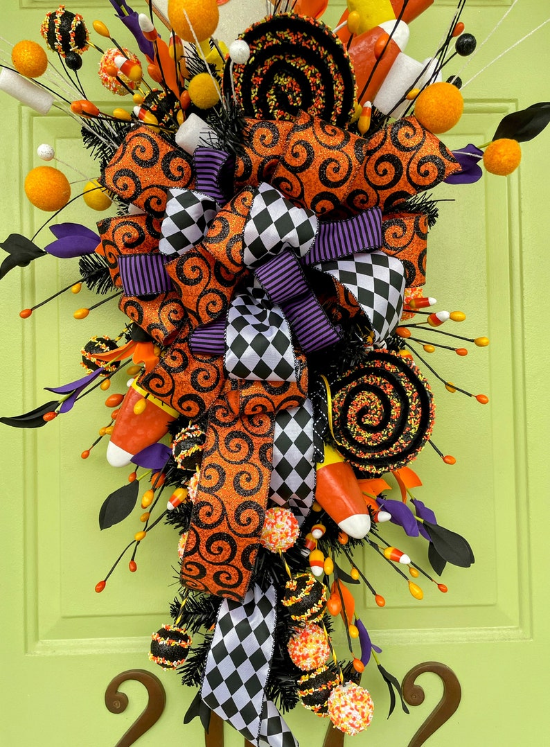 Halloween Ghosts and Sweets Swag With Candy Corn, Lollipops and Cake ...