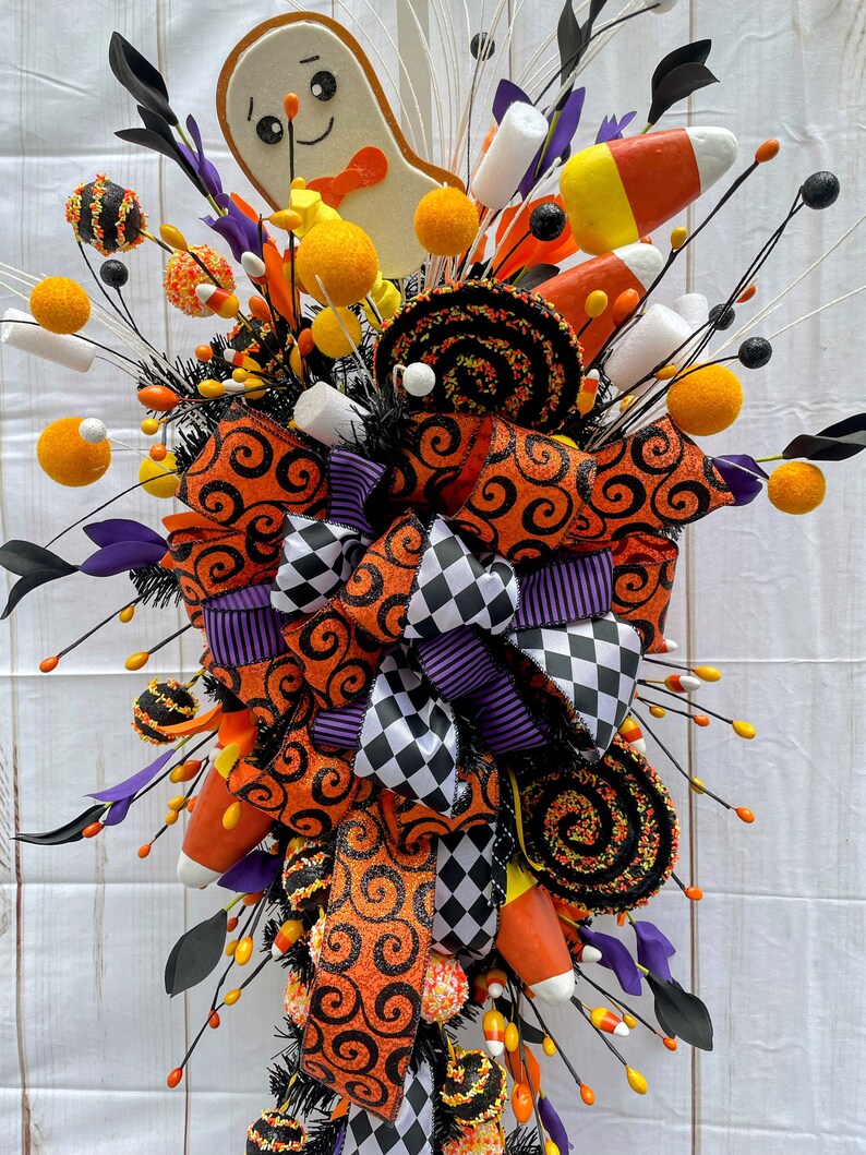 Halloween Ghosts and Sweets Swag With Candy Corn, Lollipops and Cake ...
