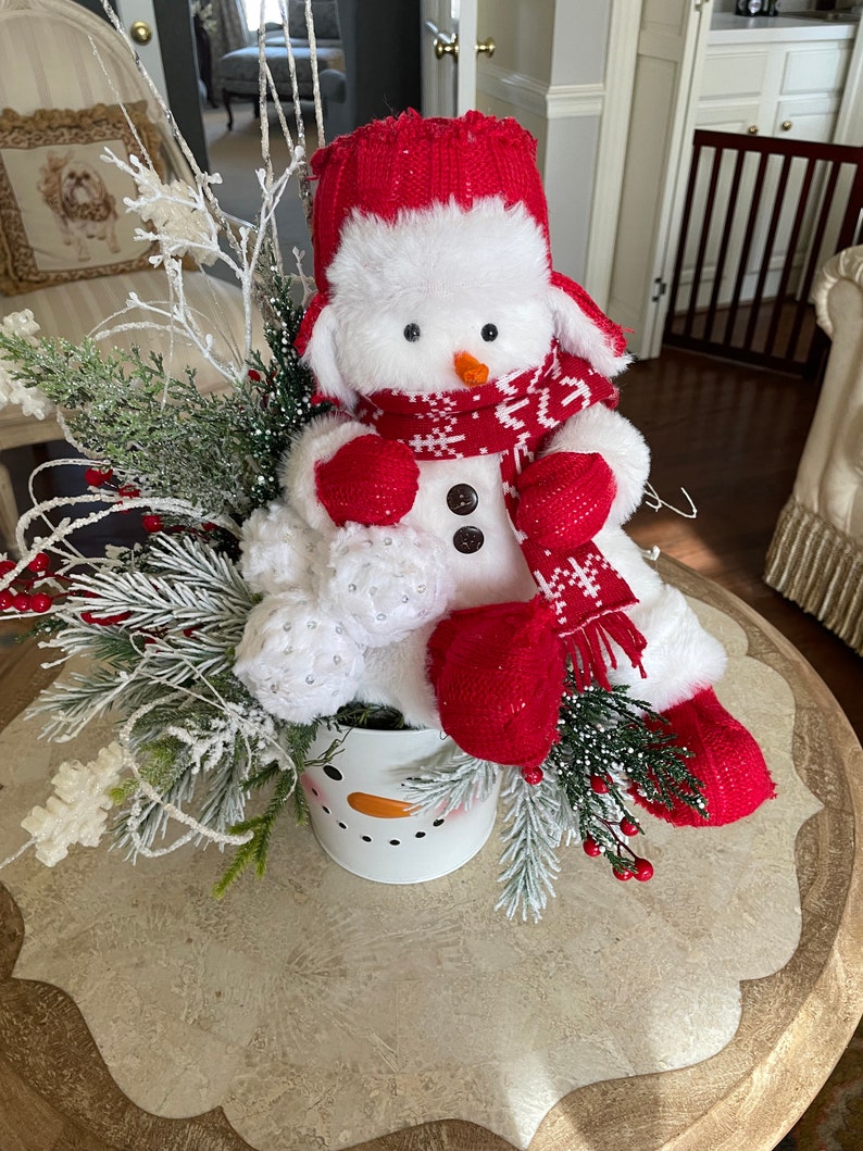 Chillin Wintery Snowman Bucket Arrangement With Bundled Snowboy Wearing ...