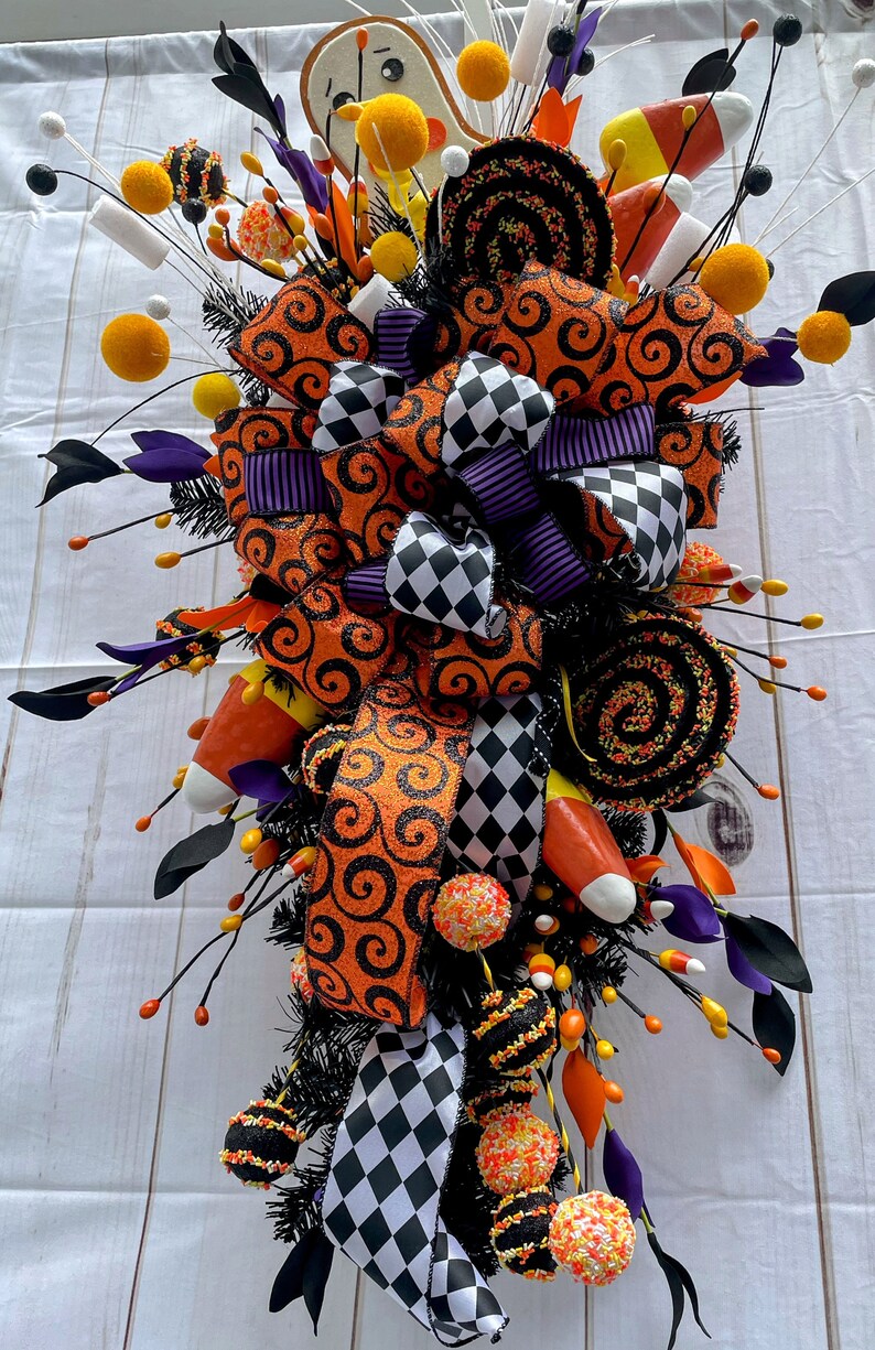 Halloween Ghosts and Sweets Swag With Candy Corn, Lollipops and Cake ...