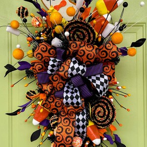 Halloween Ghosts and Sweets Swag With Candy Corn, Lollipops and Cake ...