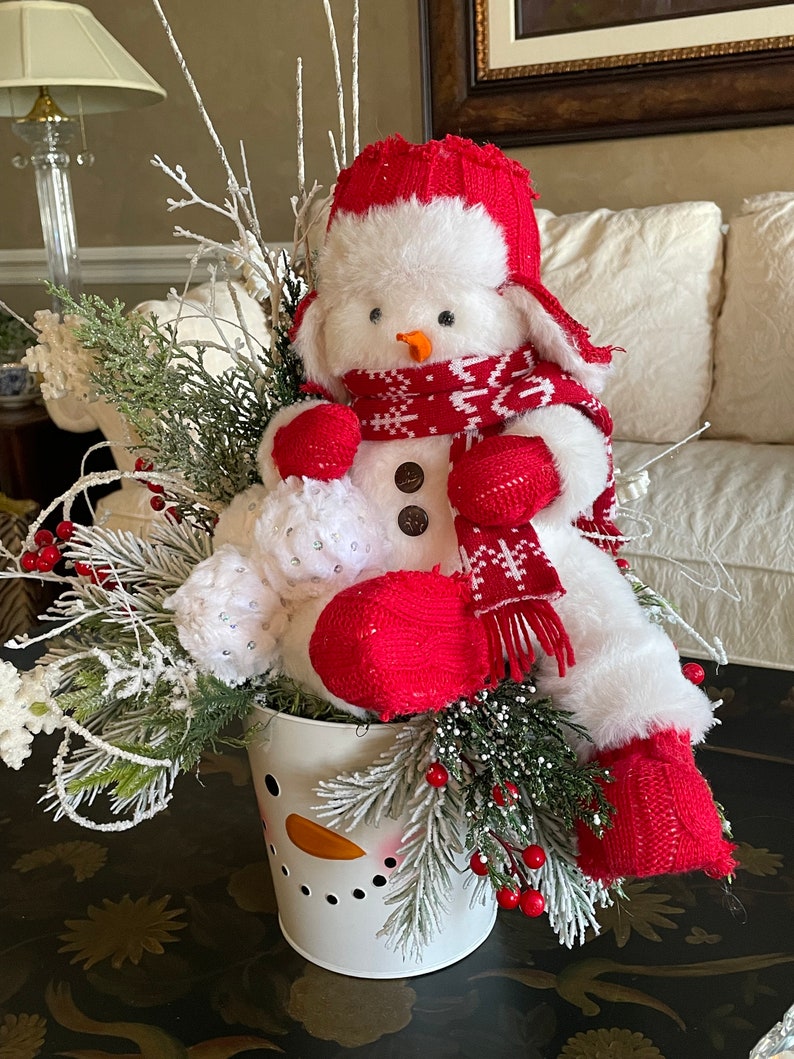 Chillin Wintery Snowman Bucket Arrangement With Bundled Snowboy Wearing ...