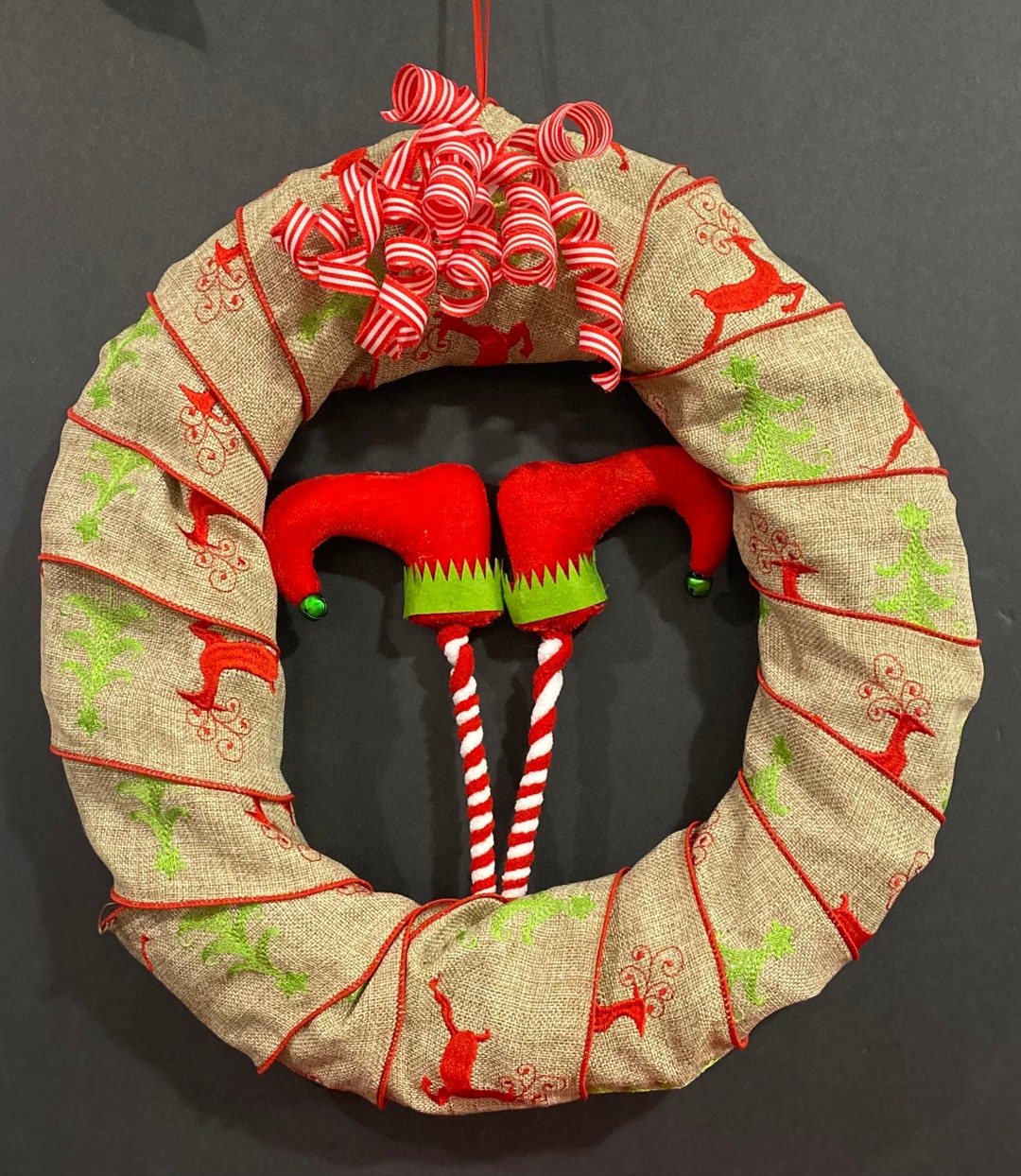 Christmas Wreath Featuring Upside Down Elf-like Shoes on Top of Candy ...