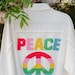 New Womens Soft White Rainbow Peace Sign Distressed Oversized Utility ...