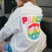 New Womens Soft White Rainbow Peace Sign Distressed Oversized Utility ...