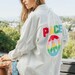 New Womens Soft White Rainbow Peace Sign Distressed Oversized Utility ...