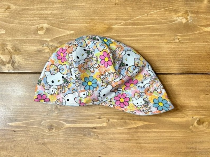 Floral Hello Kitty Welding Cap Flowers Hello Kitty Reversible Pipe ...