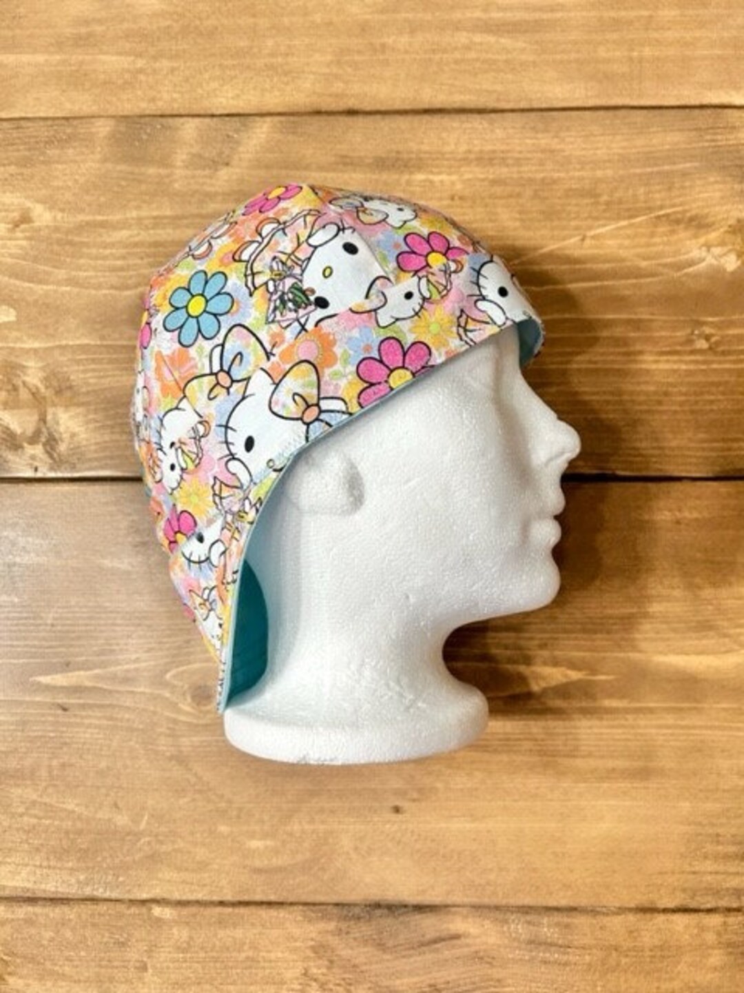 Floral Hello Kitty Welding Cap Flowers Hello Kitty Reversible Pipe ...