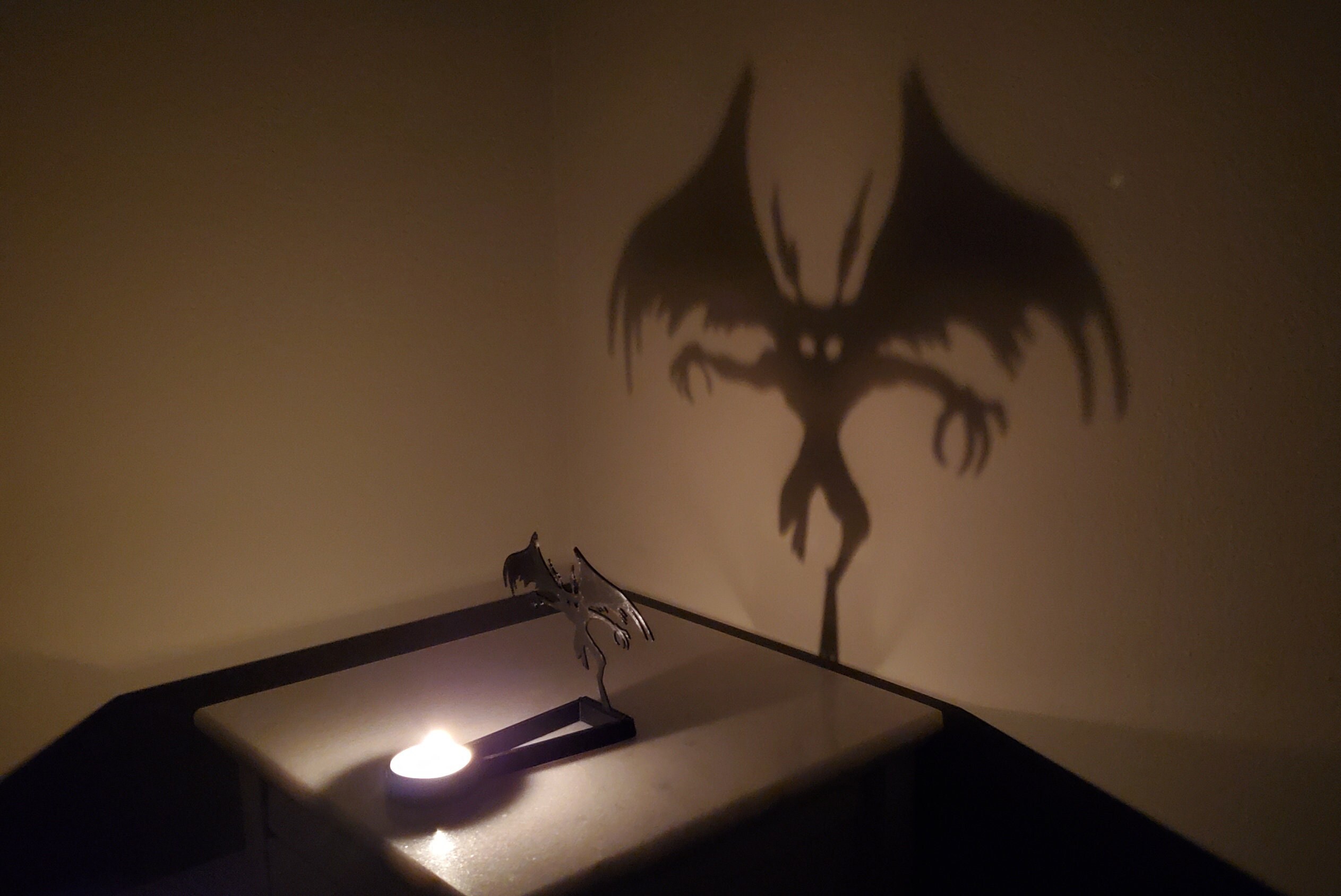 Kealite Mothman Shadow Caster tealight Candle Sold - Etsy