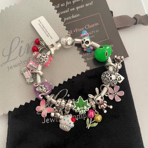 Linx Silver Snake Chain Bracelet With Girly Skull Voodoo Doll Pot Leaf ...