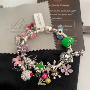 Linx Silver Snake Chain Bracelet With Girly Skull Voodoo Doll Pot Leaf ...