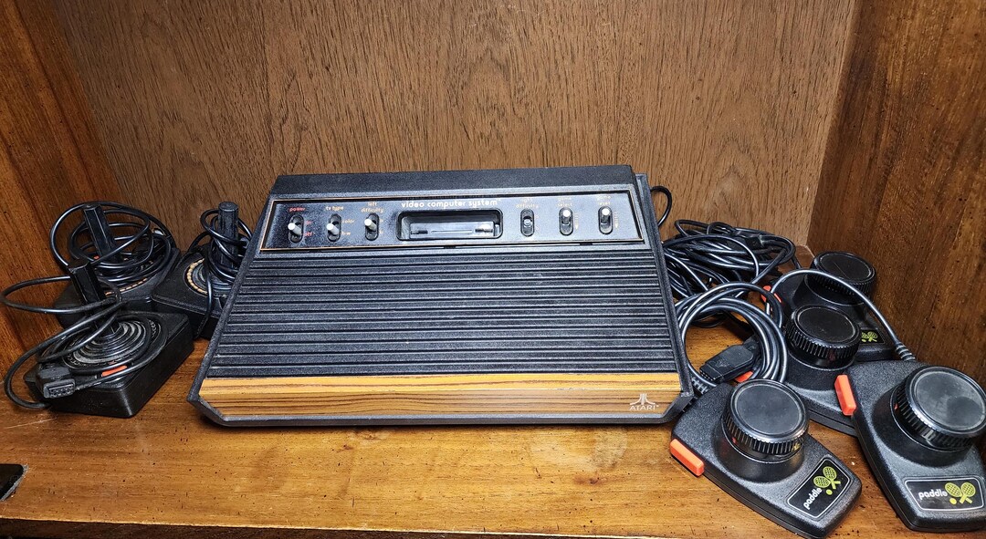 Vintage Atari 2600 Woodgrain Gaming System With Joystick and Paddle ...