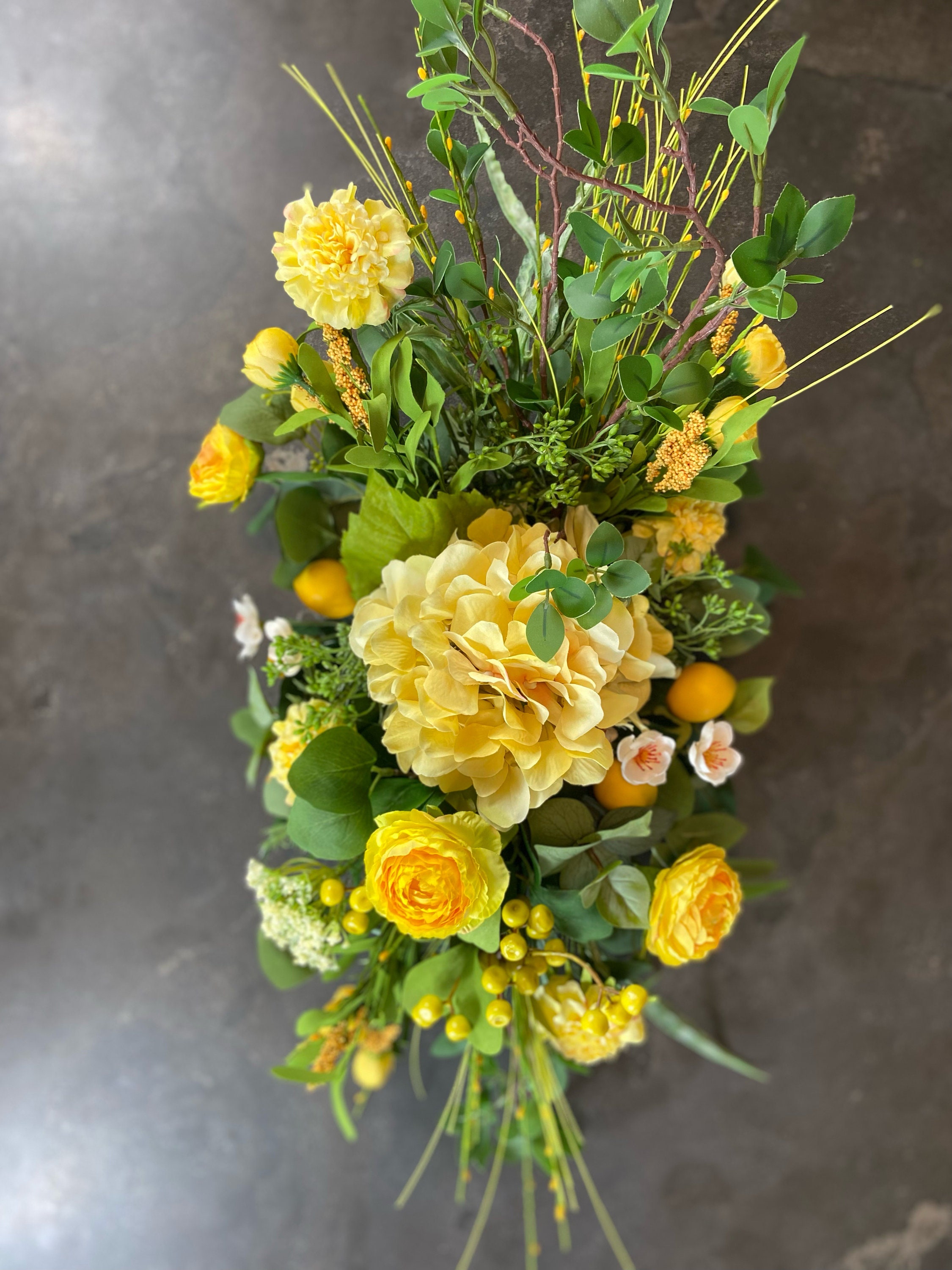 Oblong Yellow Hydrangea, Ranunculus, Lemons, and Greenery Arrangement ...