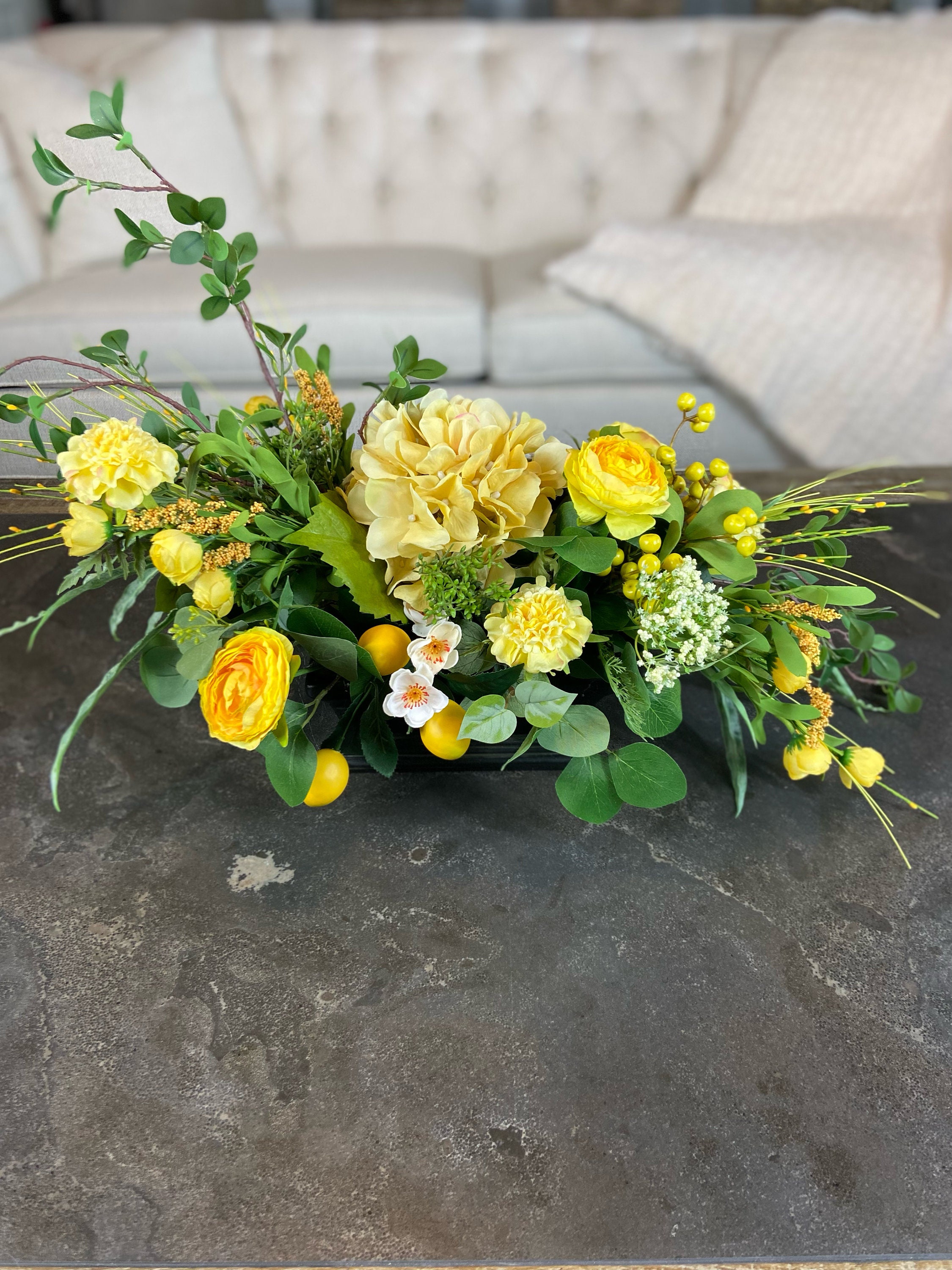 Oblong Yellow Hydrangea, Ranunculus, Lemons, and Greenery Arrangement ...