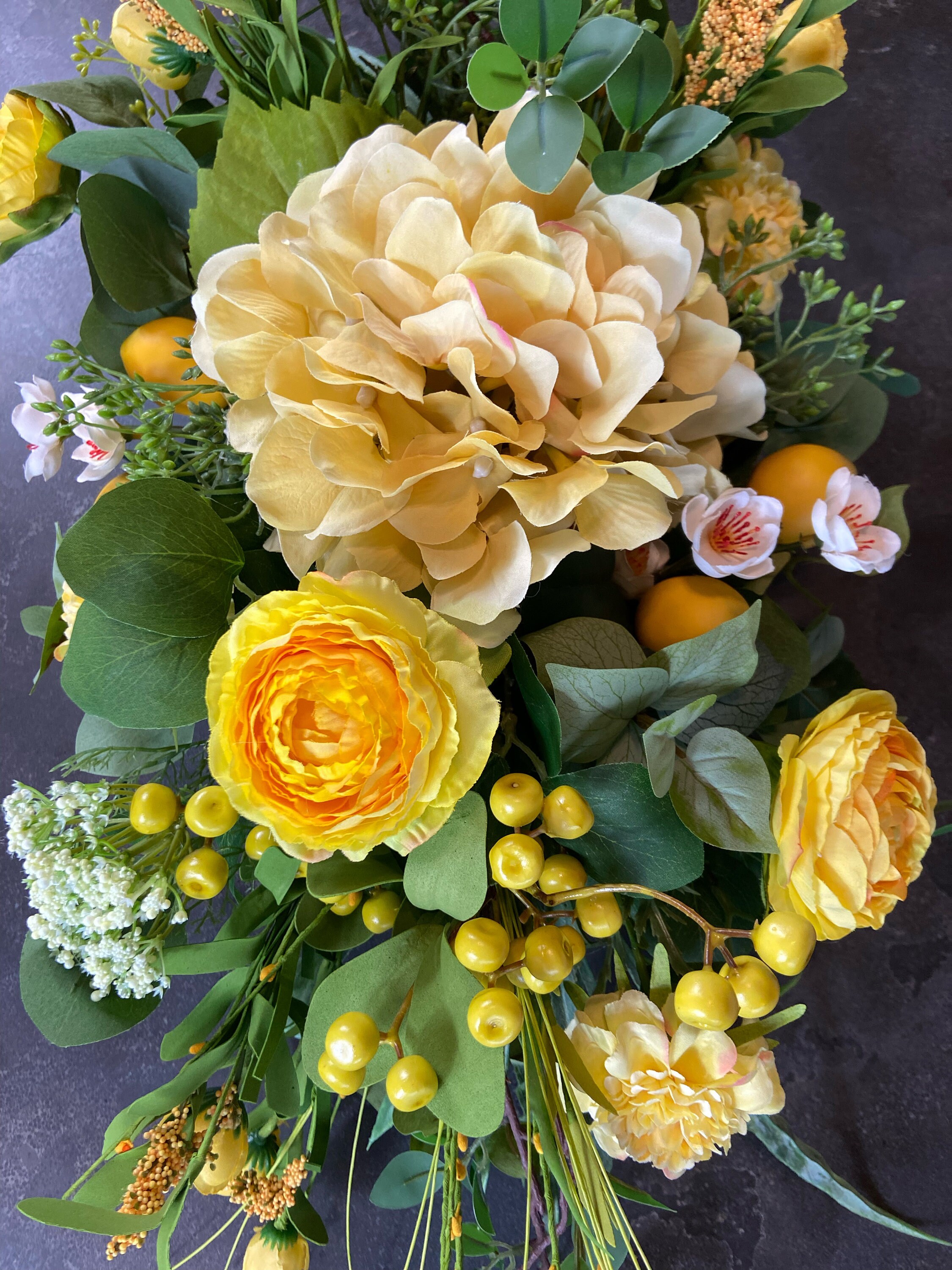 Oblong Yellow Hydrangea, Ranunculus, Lemons, and Greenery Arrangement ...