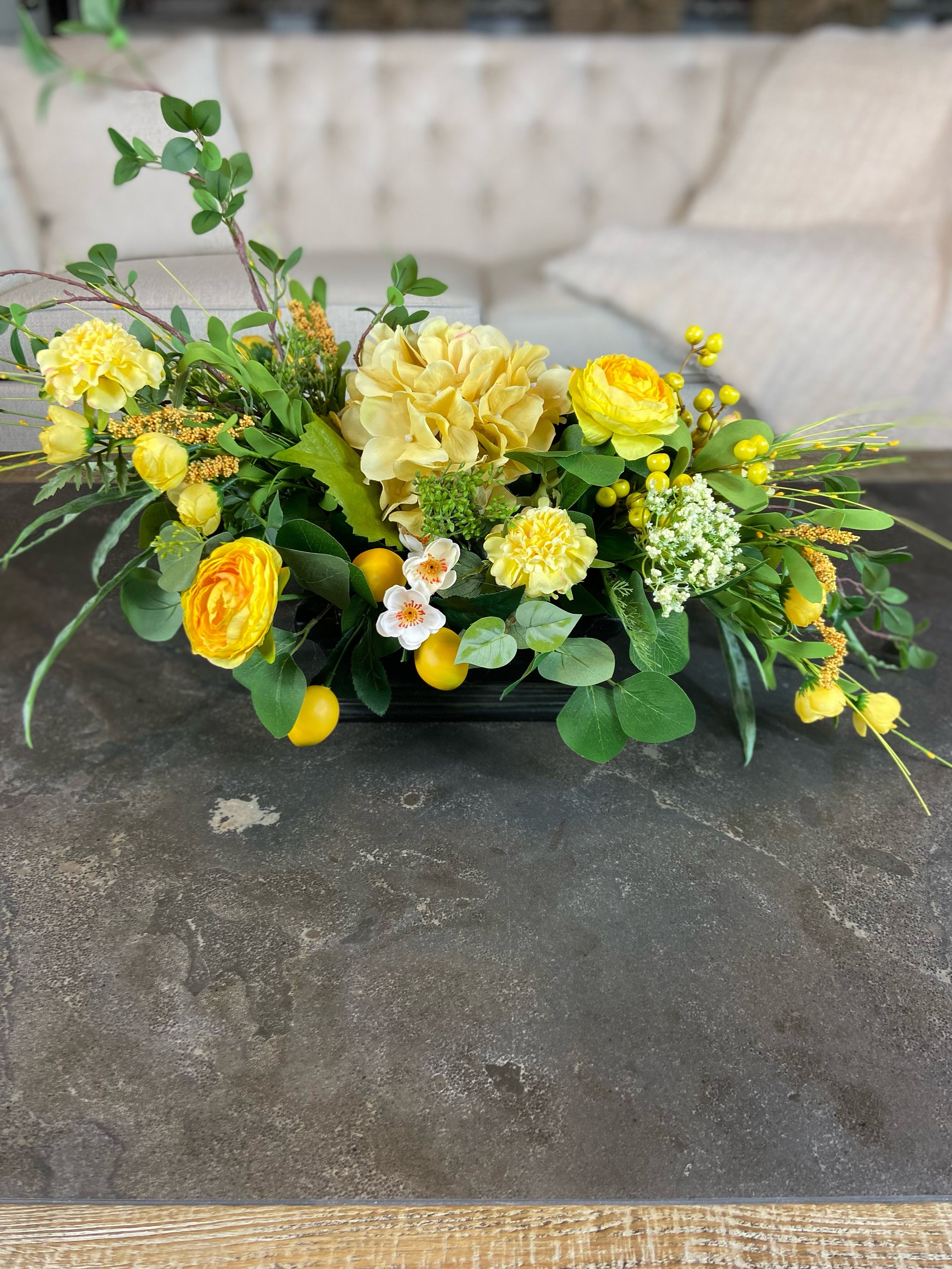 Oblong Yellow Hydrangea, Ranunculus, Lemons, and Greenery Arrangement ...