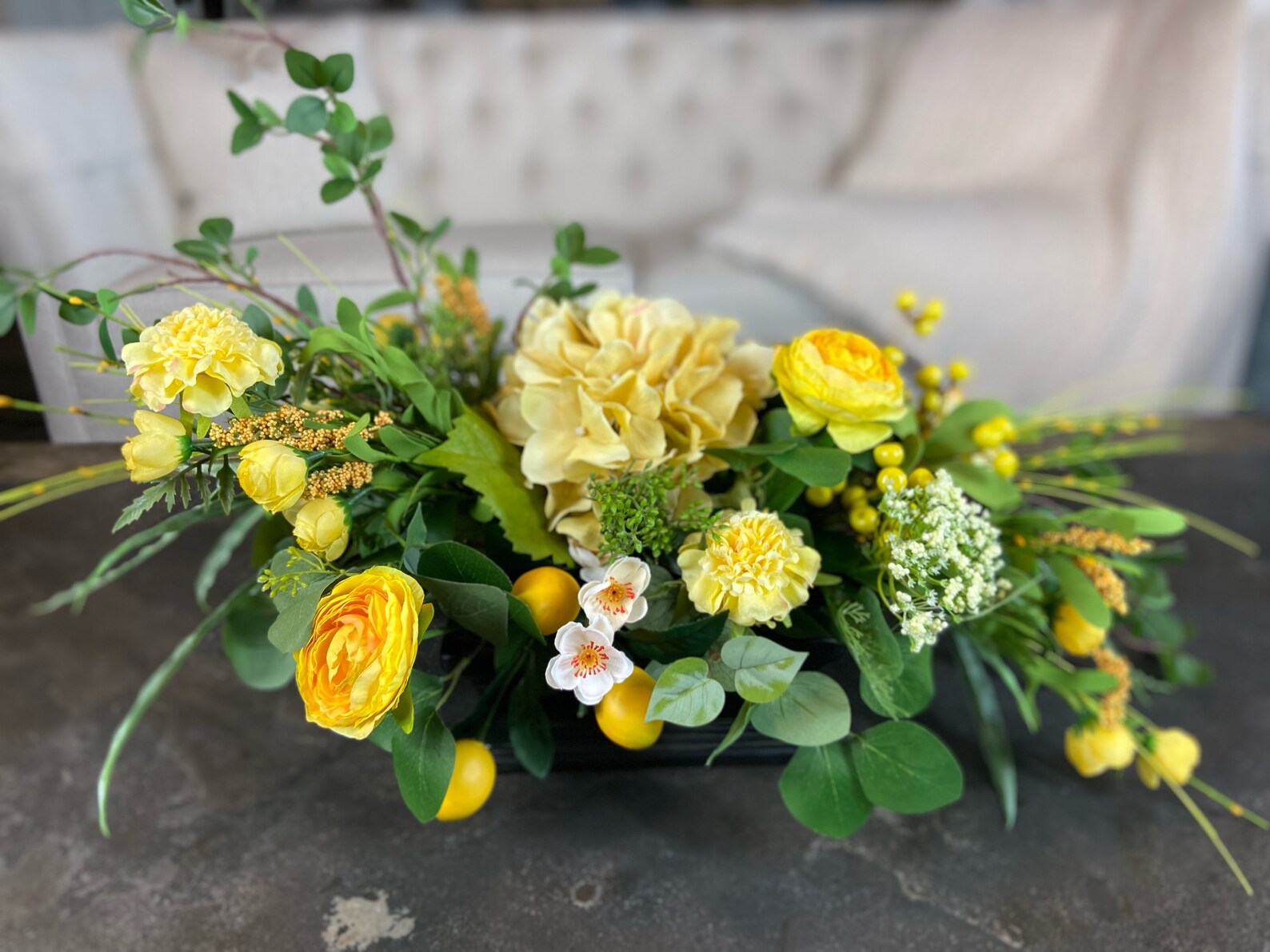 Oblong Yellow Hydrangea, Ranunculus, Lemons, and Greenery Arrangement ...