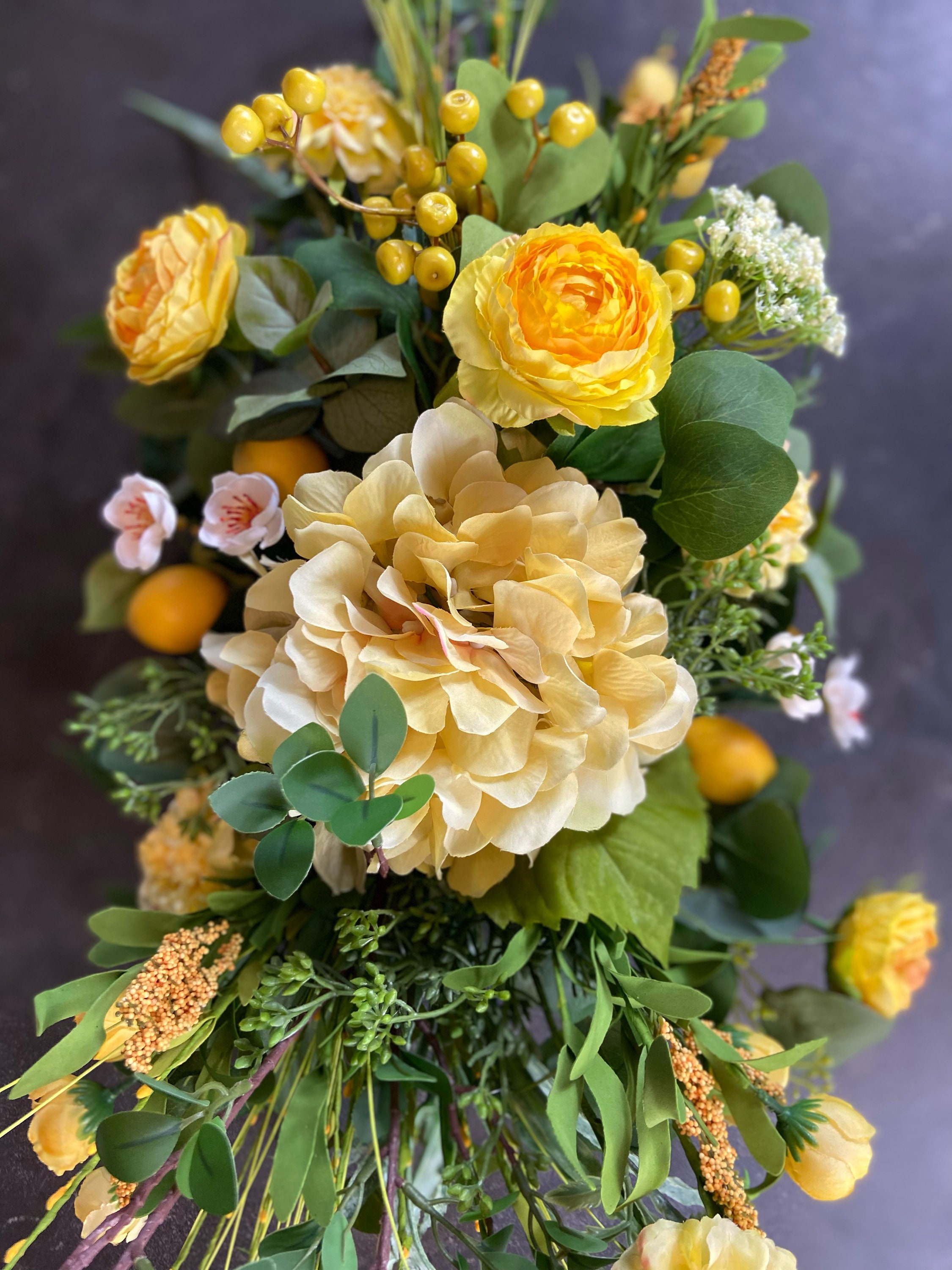 Oblong Yellow Hydrangea, Ranunculus, Lemons, and Greenery Arrangement ...