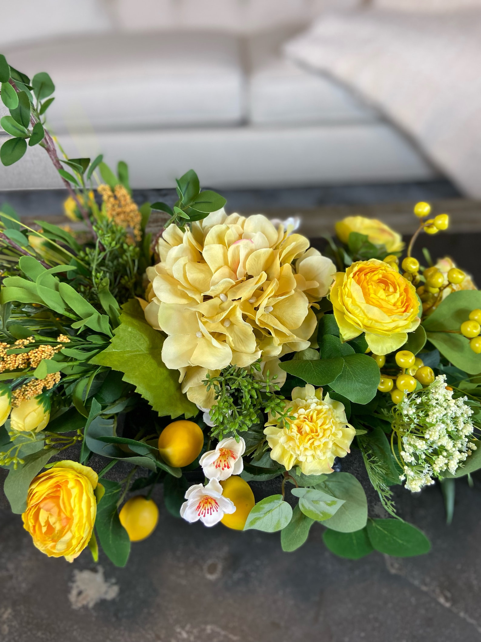 Oblong Yellow Hydrangea, Ranunculus, Lemons, and Greenery Arrangement ...
