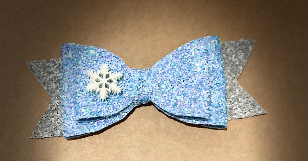 Frozen Majesty: Elsa-inspired Faux Leather Bow With Blue and Silver ...