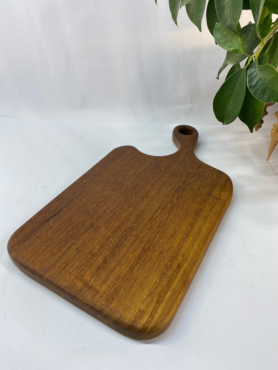It is Made of IROKO Wood. It is a Serving Board and a Chopping Board ...