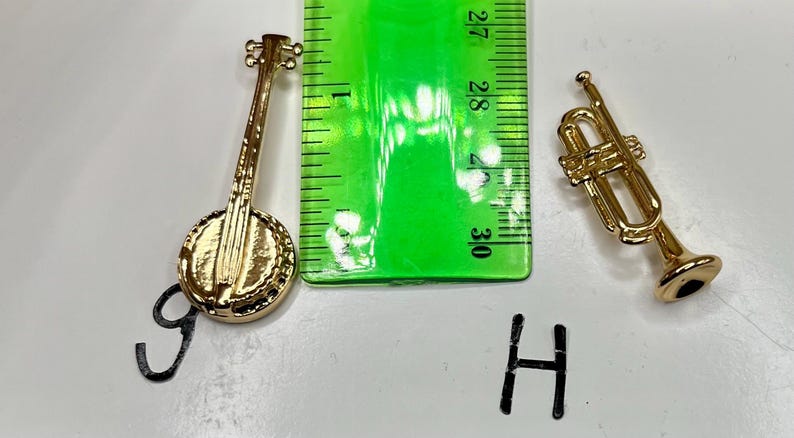 Tiny Golden Musical Instruments: Bass Guitar Violin Maracas Drums ...