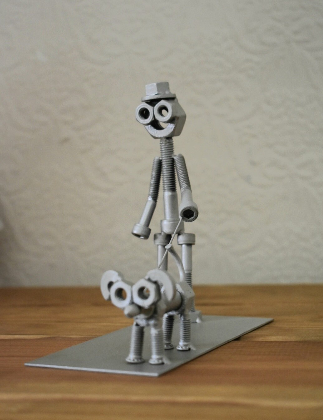 Man and Dog Metal Art Nut and Bolt Sculpture of Man and His Dog. Scrap ...