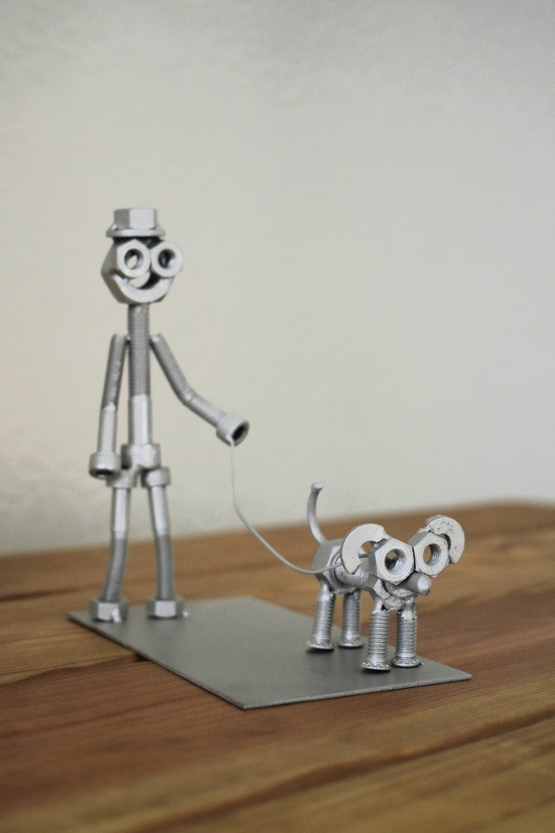 Man and Dog Metal Art Nut and Bolt Sculpture of Man and His Dog. Scrap ...