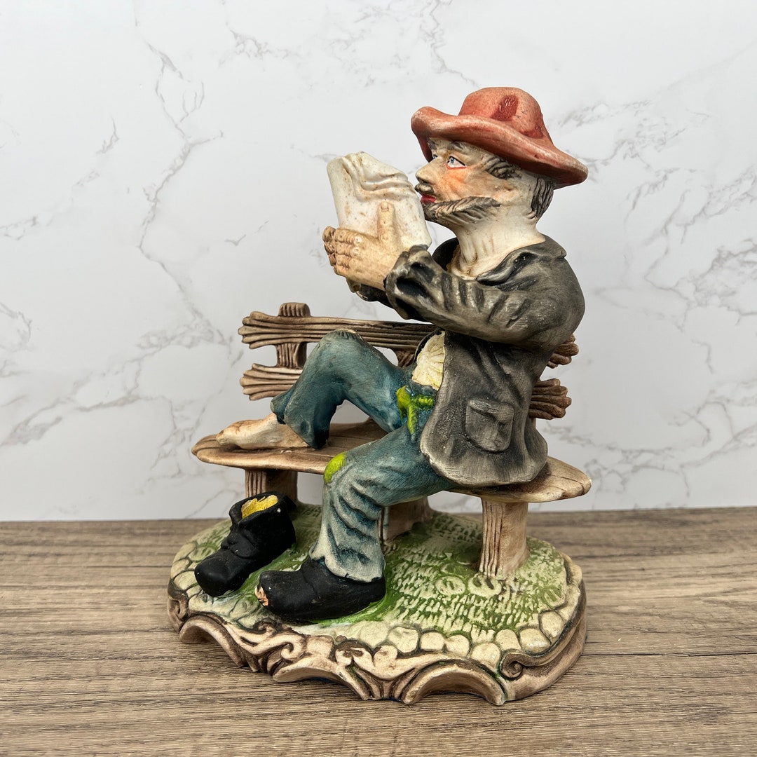 Vintage Unique Man Sitting on a Bench Reading, Beautiful Detailed ...
