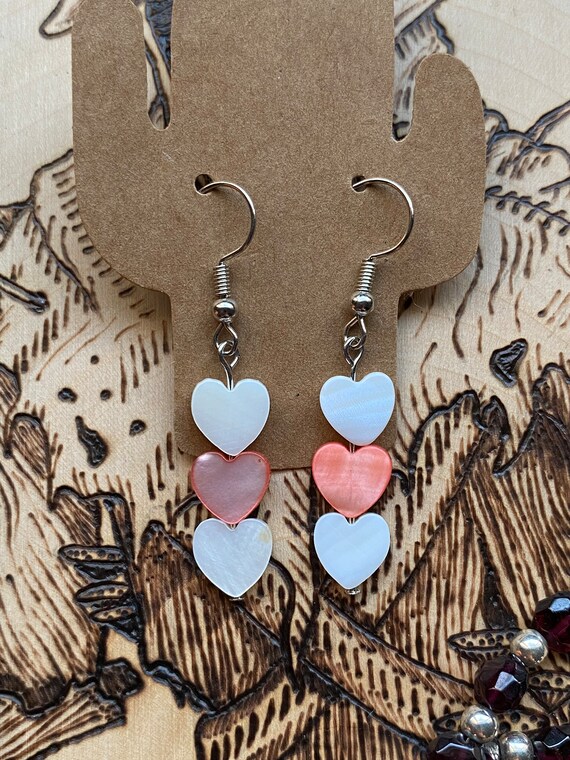 Three heart earrings store
