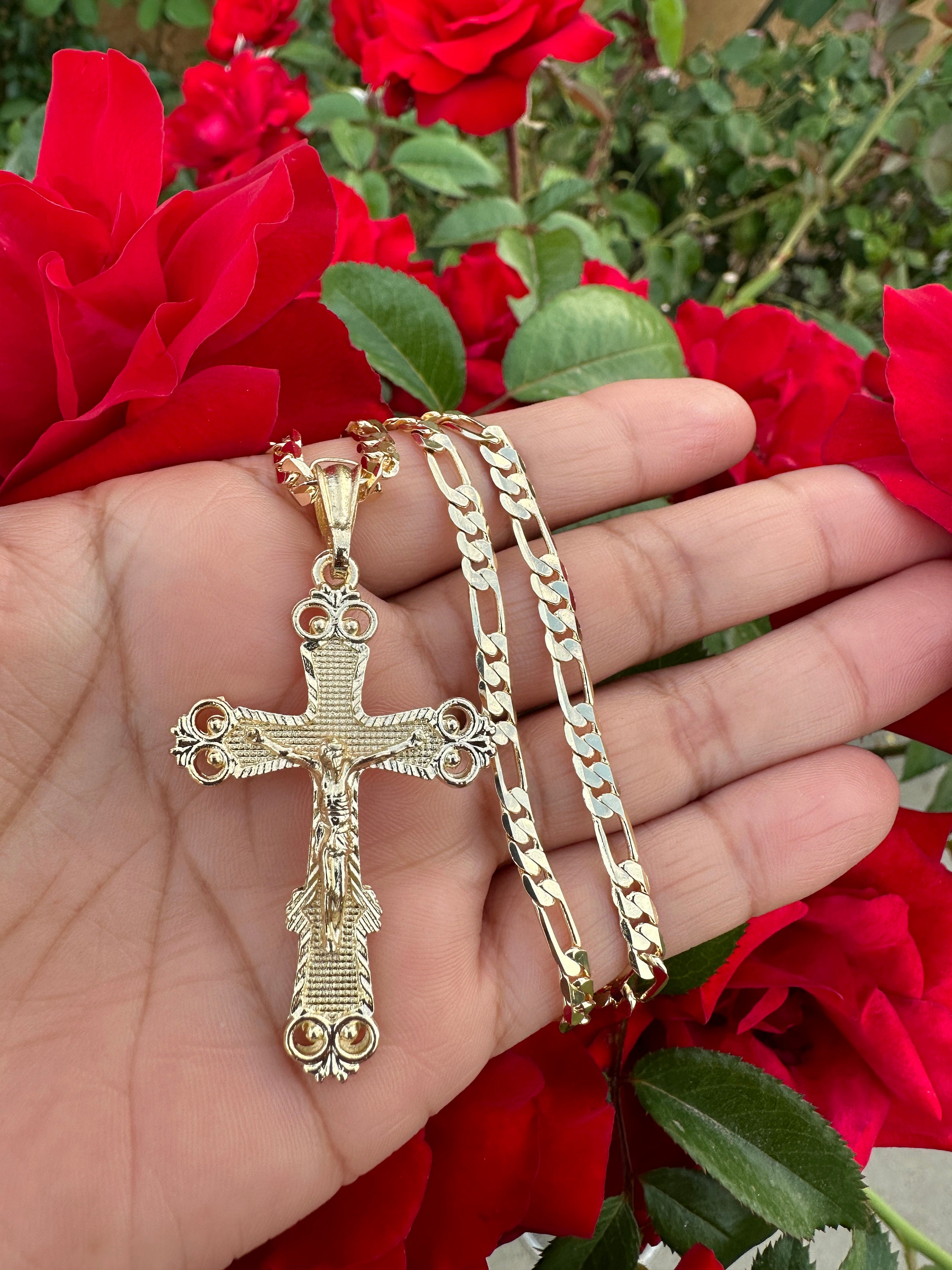 Gold figaro chain with cross store